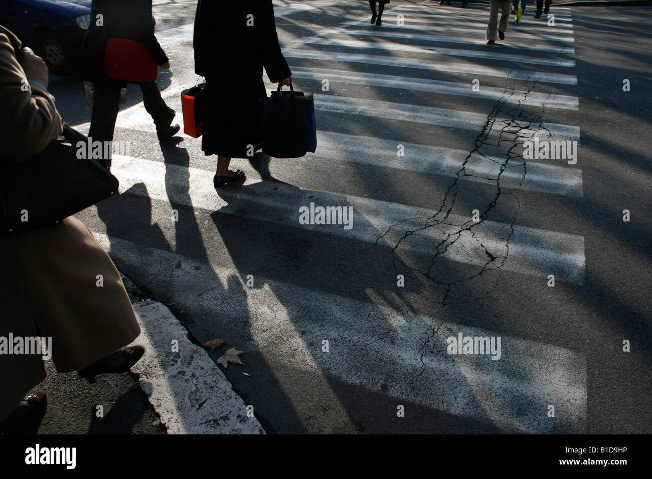 detail of people on zebra crossing in city town Stock Photo - Alamy