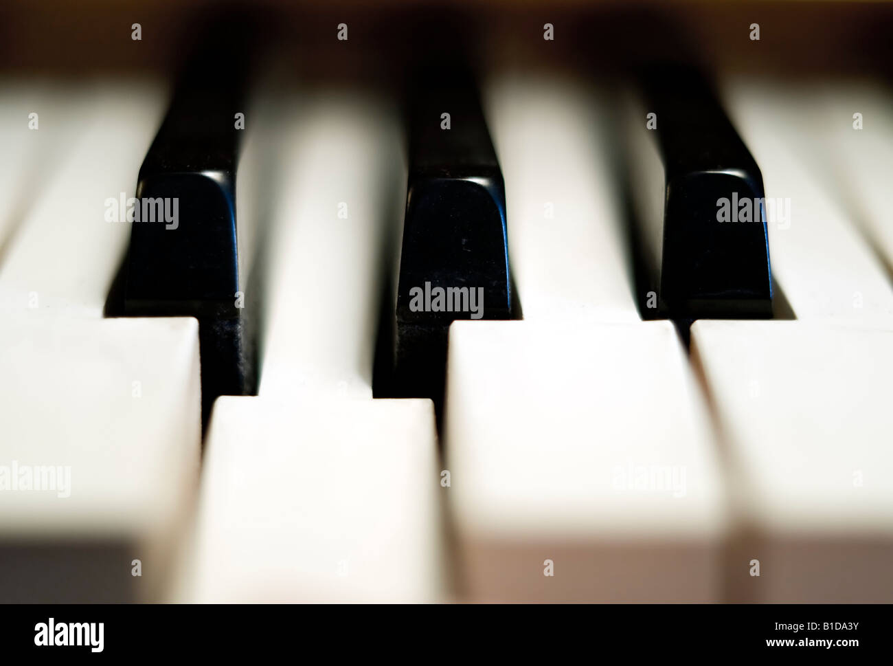 Close up of piano keys, with key depressed Stock Photo - Alamy