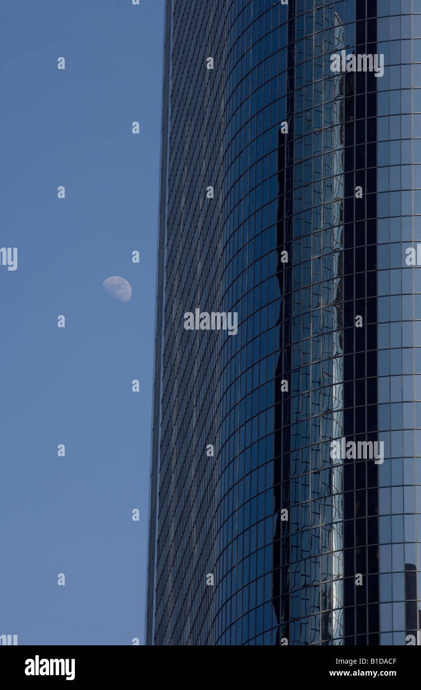 Skyscraper with moon in Los Angeles California at dusk Low angle view ...