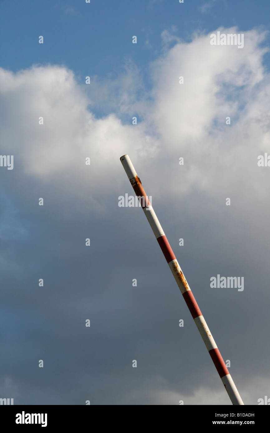 raised checkpoint barrier and blue sky Stock Photo - Alamy