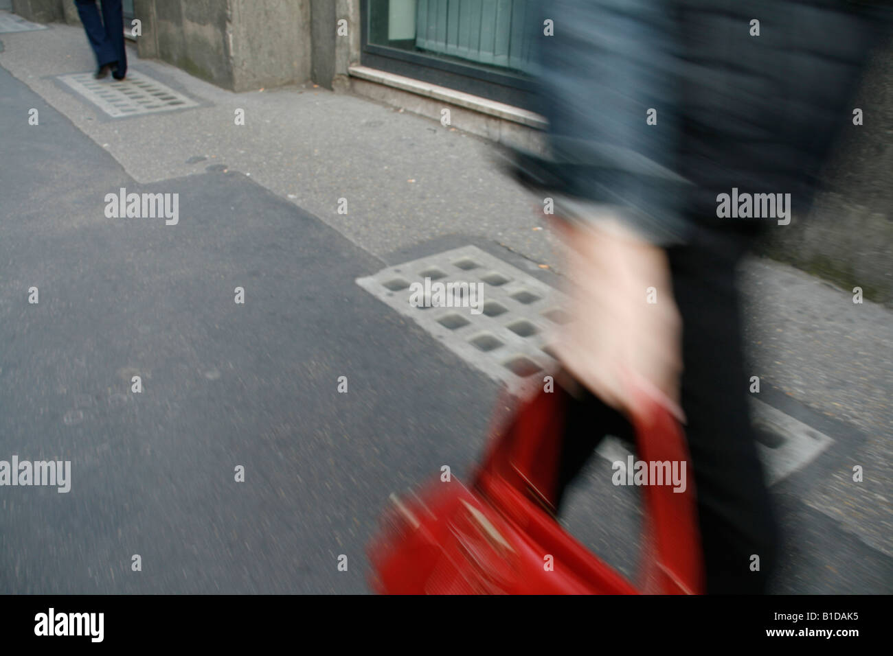 woman with red handbag running in town Stock Photo - Alamy