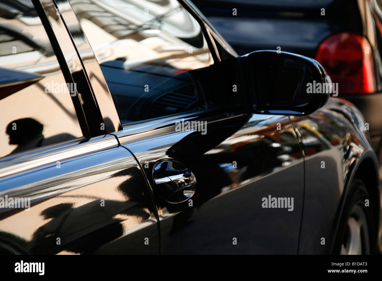 luxury black car backlit in morning sun Stock Photo - Alamy