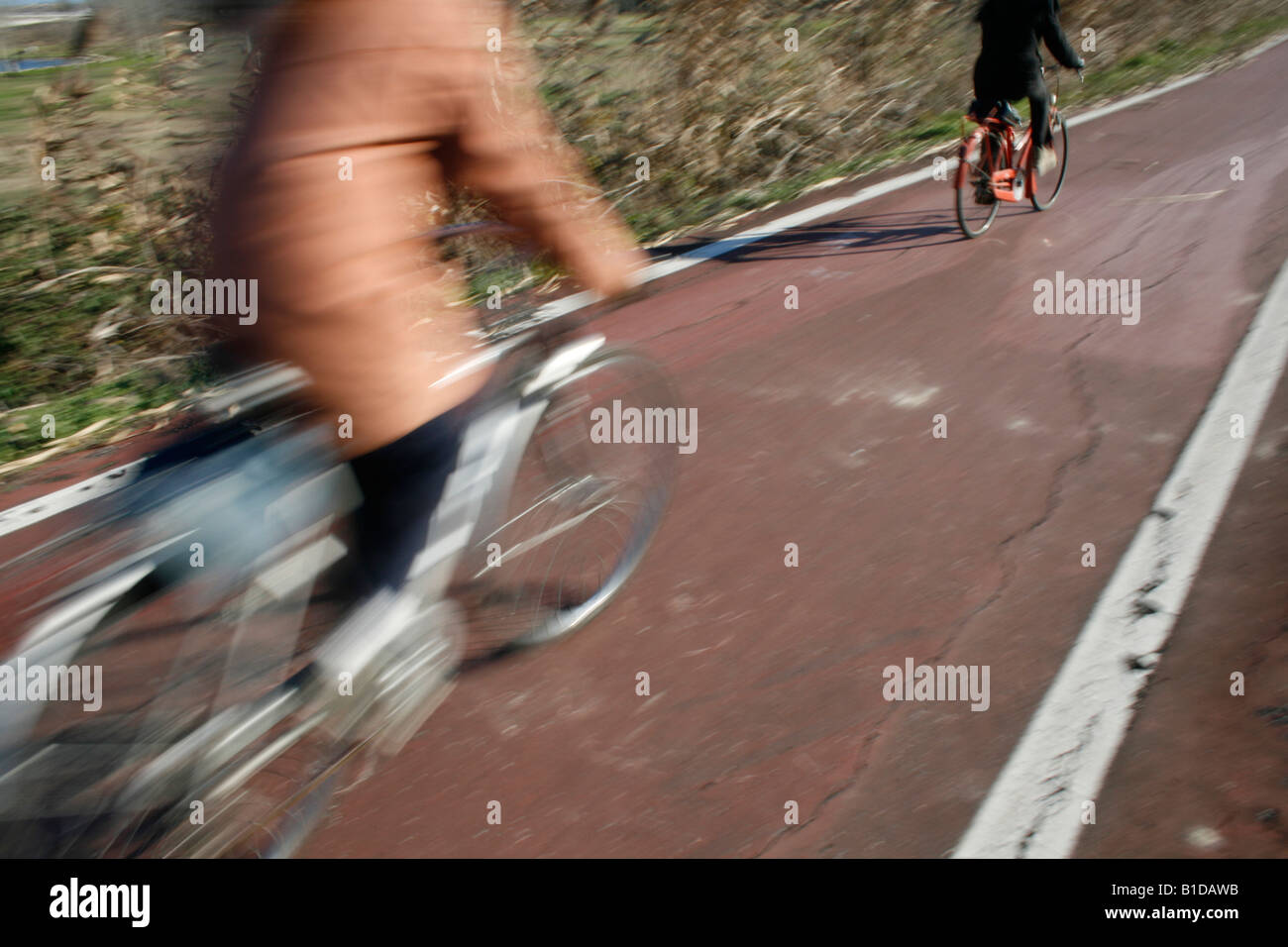 two people riding bikes on cycle path in country Stock Photo - Alamy
