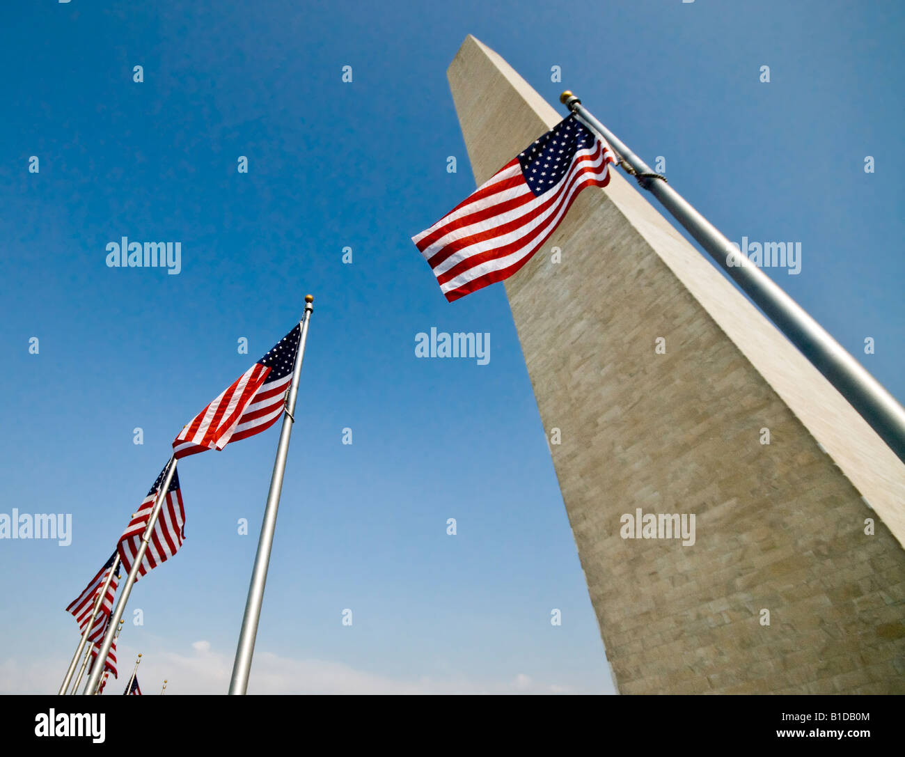 American flags and Washington Monument with a clear blue sky Stock ...