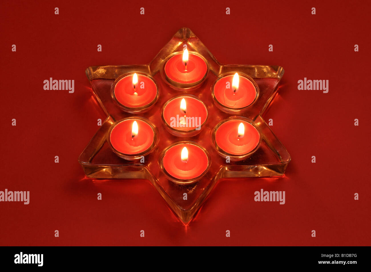 Star shaped candle holder and candles Stock Photo - Alamy