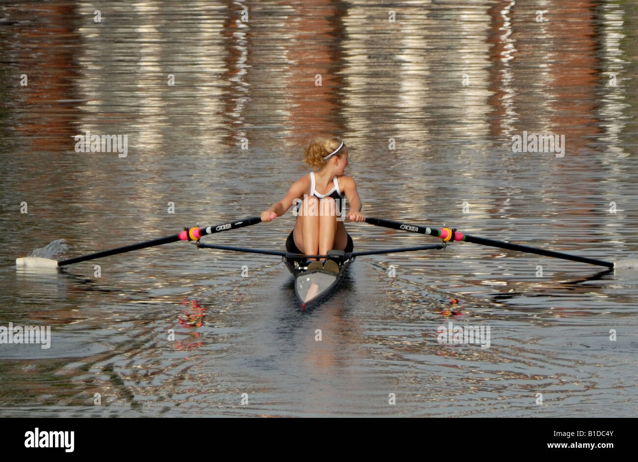 Girl rowing down the river Stock Photo - Alamy