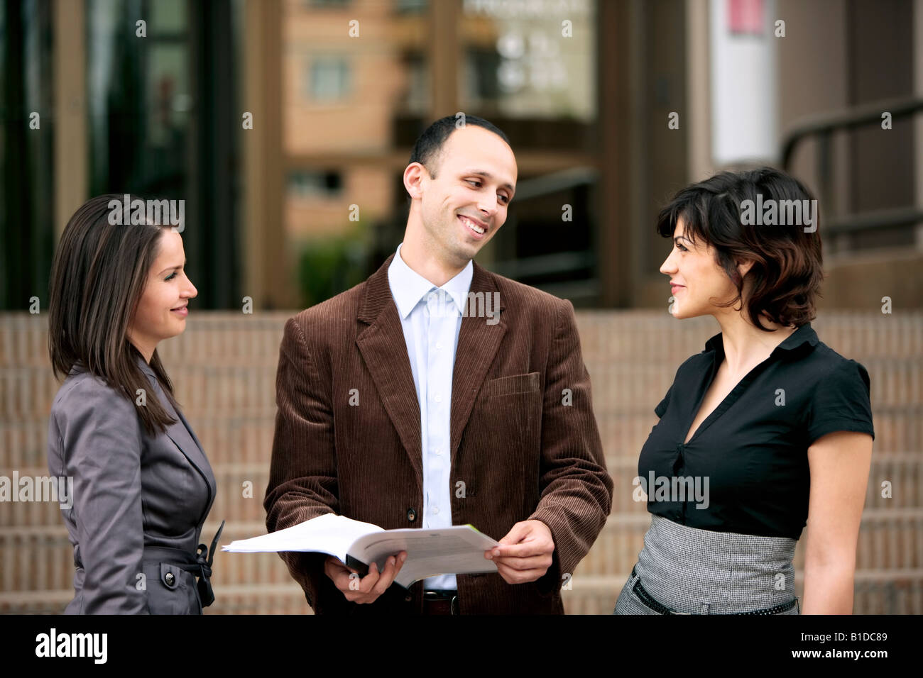 business team talking at staff meeting outdoors Stock Photo - Alamy