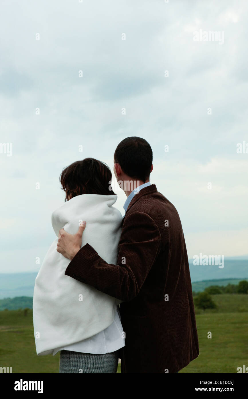 happy smiling young husband covering his smiling wife with a white ...