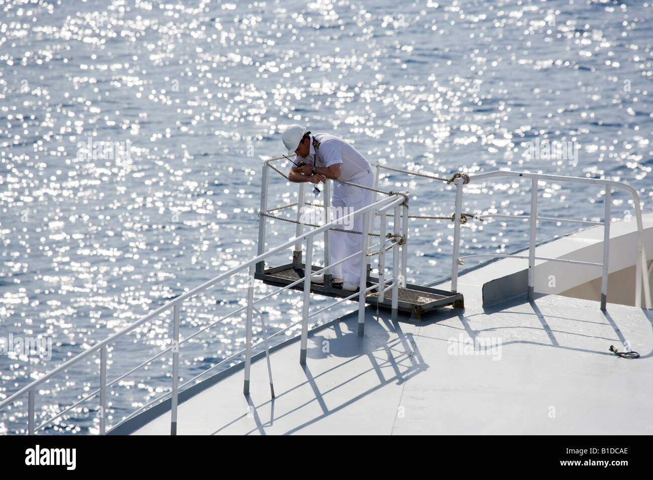 Deck officer on Cunard QE2 watching the anchor being winched Stock ...