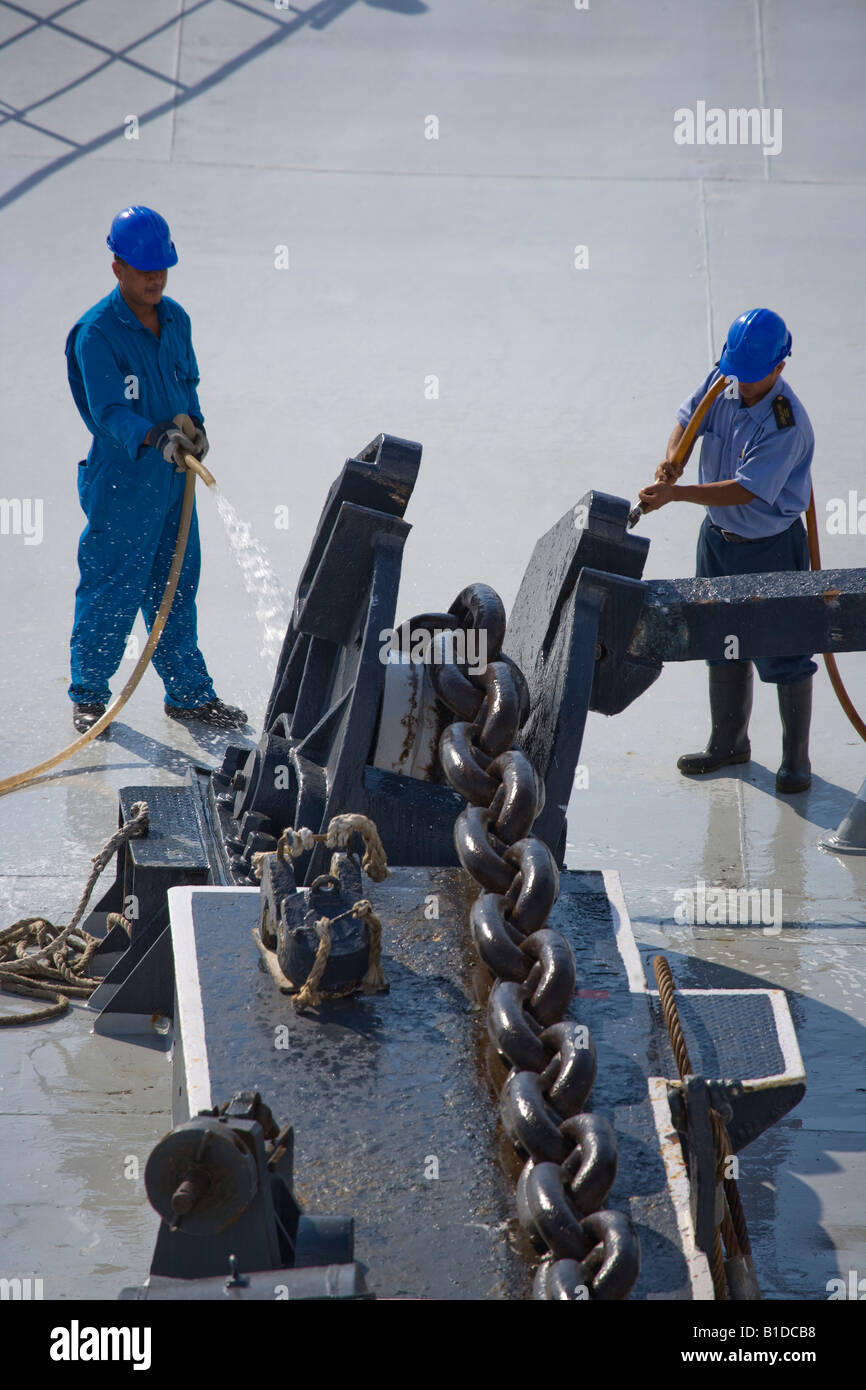 Washing the anchor chain as it is winched in on Cunard QE2 Stock Photo ...