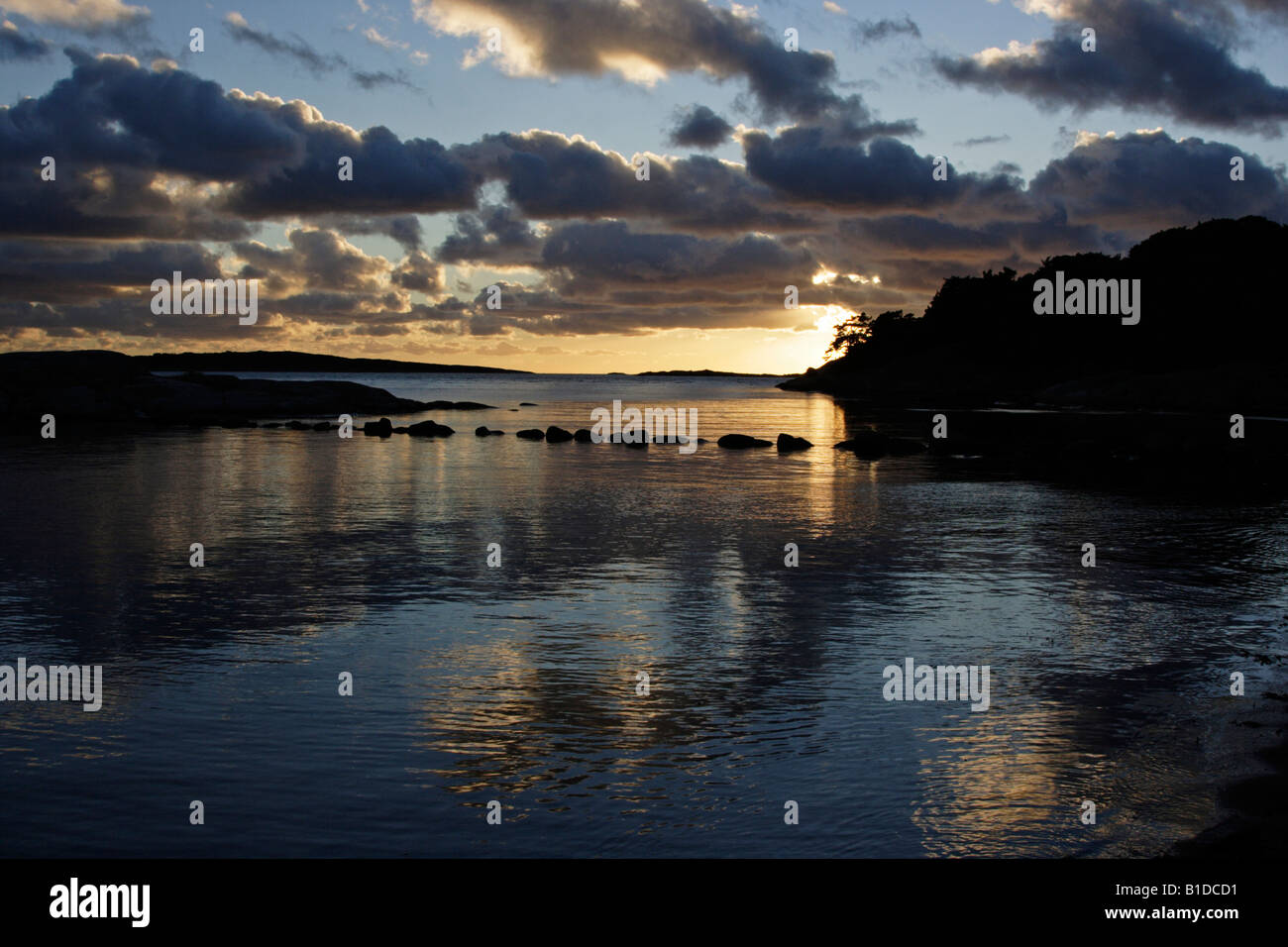 Sunset in the autumn sea Stock Photo - Alamy