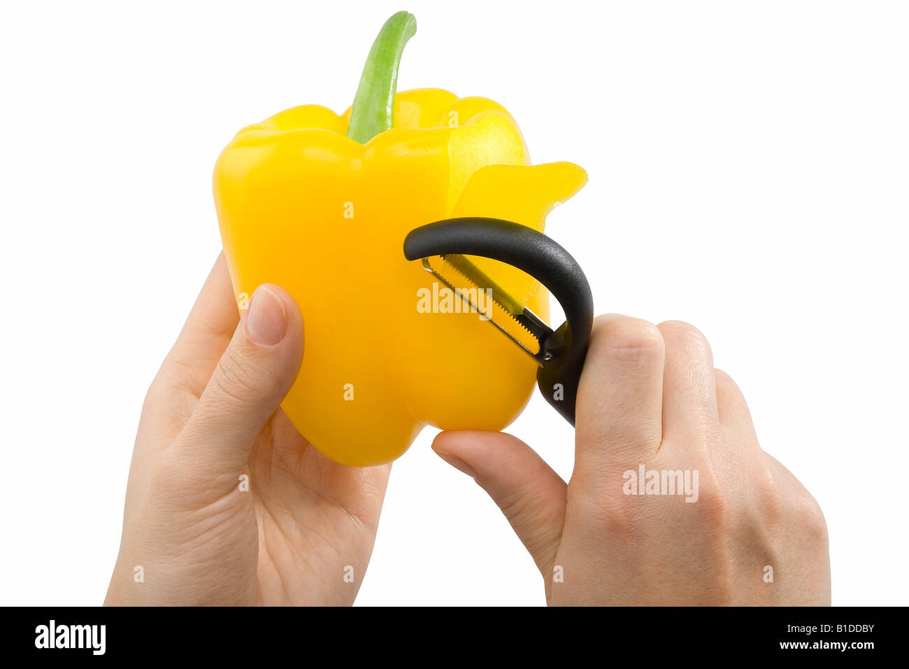 Hands peeling a yellow pepper Stock Photo - Alamy