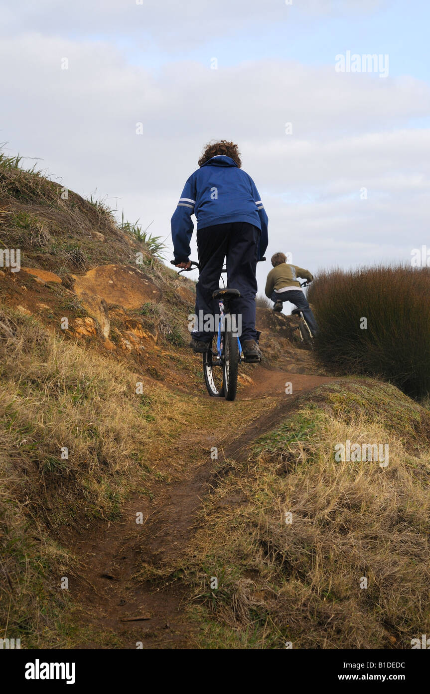 Two Boys Pedalling up a hill Stock Photo - Alamy