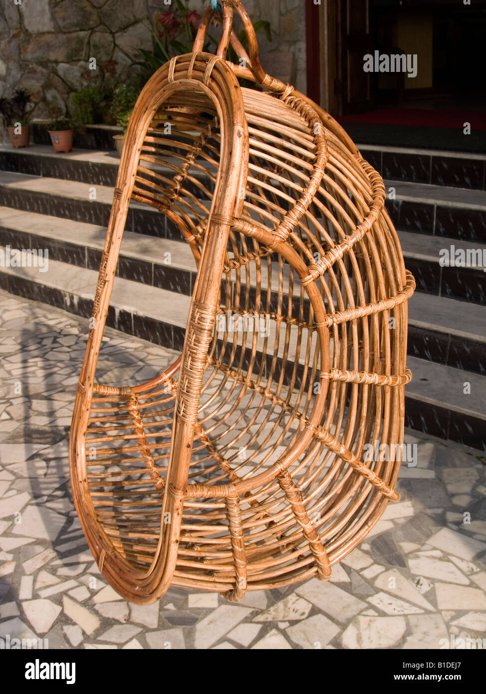 wicker chair on the patio of a resort in Meghalaya India Stock Photo ...