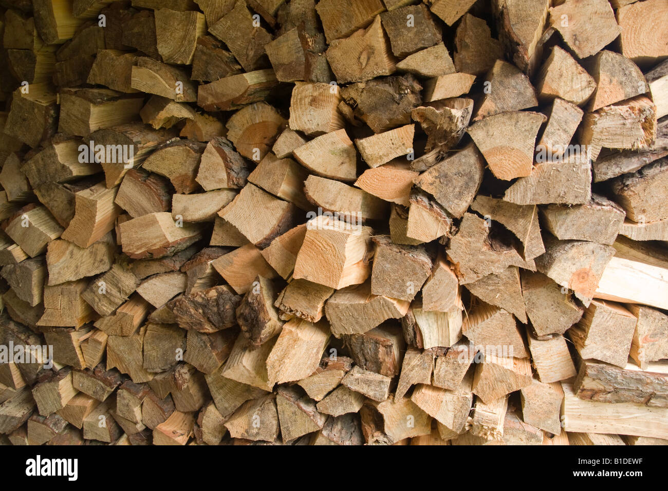 Stack of split logs Hampshire England Stock Photo - Alamy