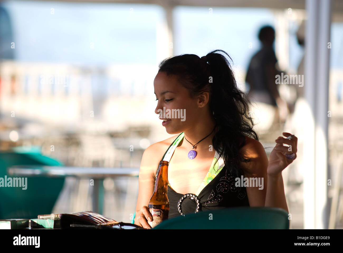 Young girl in a bar at Parque Maceo, Havana Stock Photo - Alamy