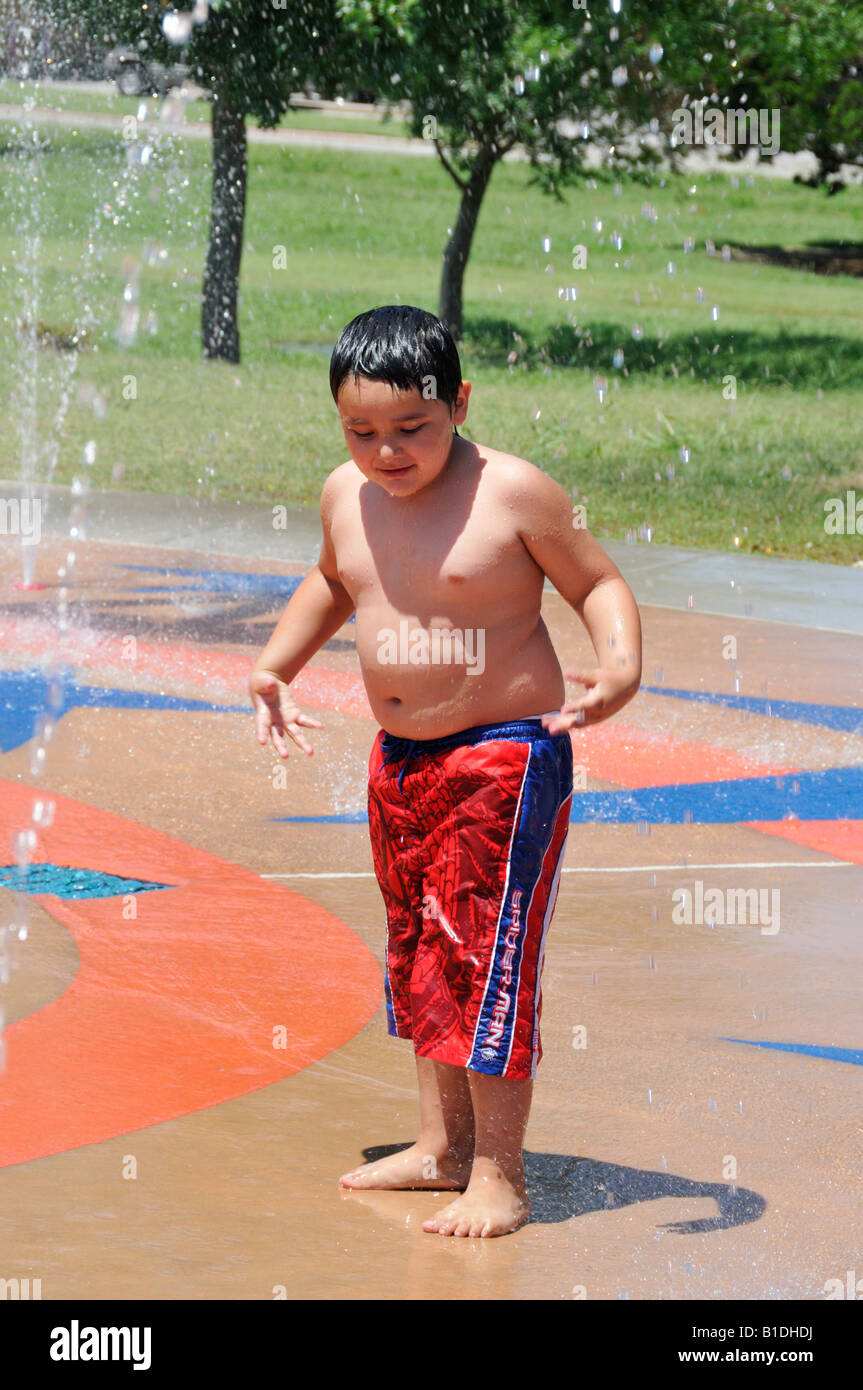 Hispanic kid water splash hi-res stock photography and images - Alamy
