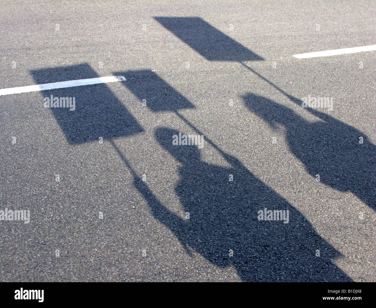 Shadows of demonstrators on Road Stock Photo - Alamy