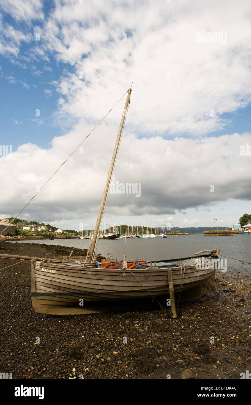 A wooden boat at low tide in Tarbert, Loch Fyne, Scotland an idyllic ...