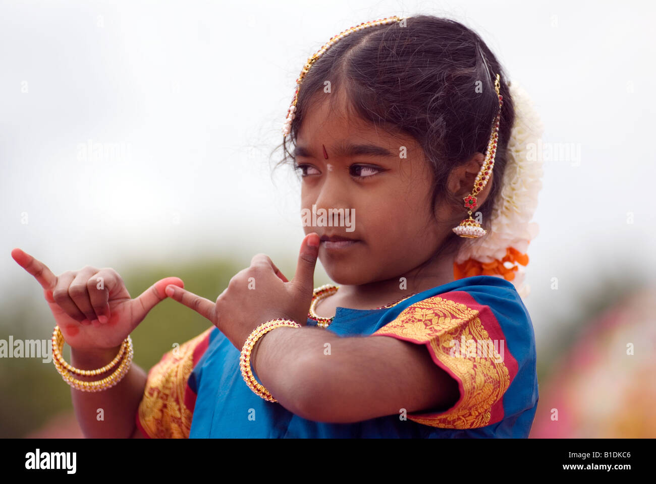 A girl doing a traditional Indian dance at the Nipponzan Myohoji ...