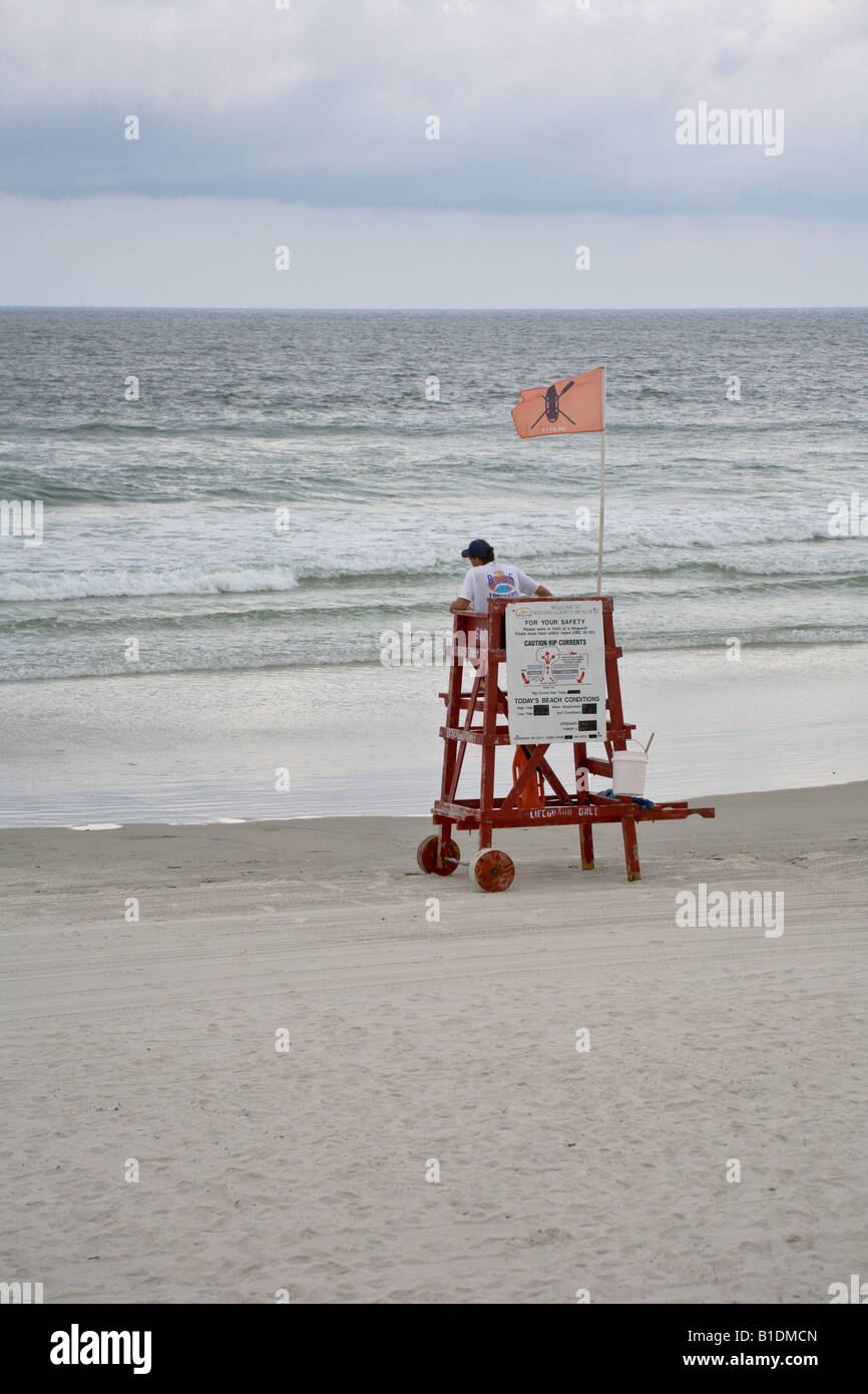 Lifeguard on duty sitting on lifeguard stand at Atlantic Ocean beach in ...