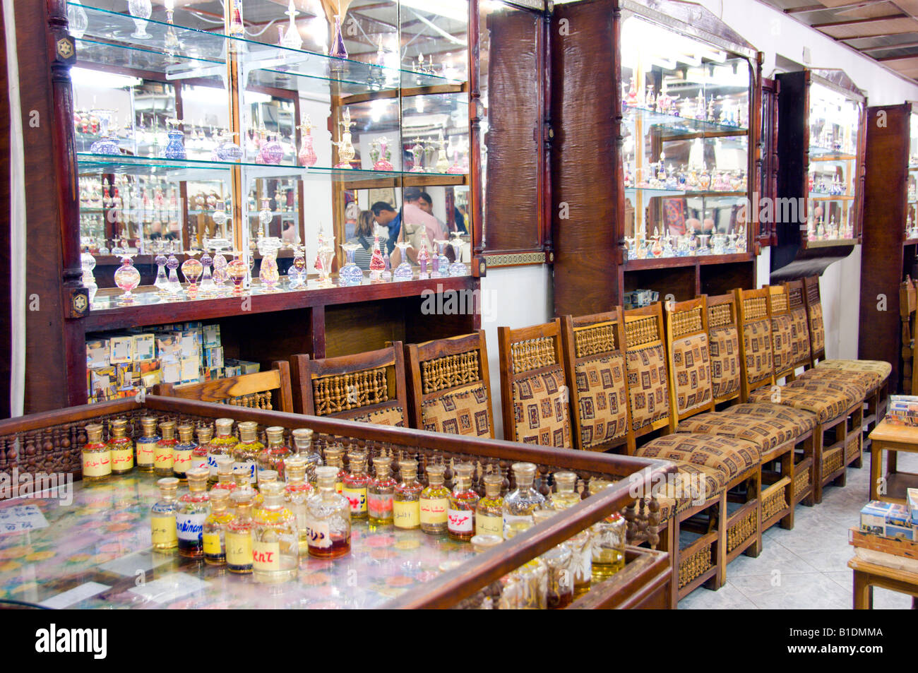 Glass cabinets filled with small perfume glass vials and Egyptian ...