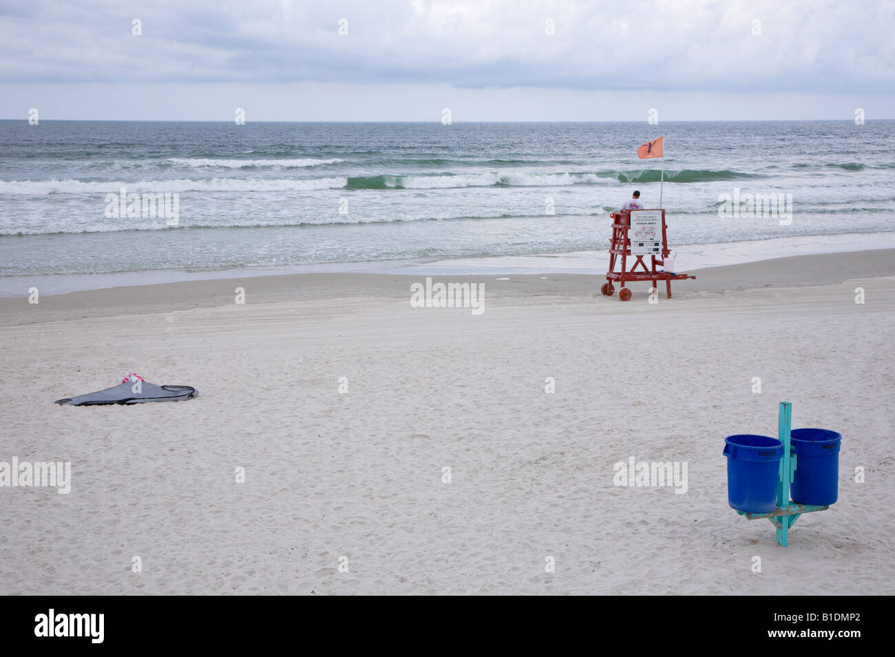 Lifeguard on duty sitting on lifeguard stand at Atlantic Ocean beach in ...