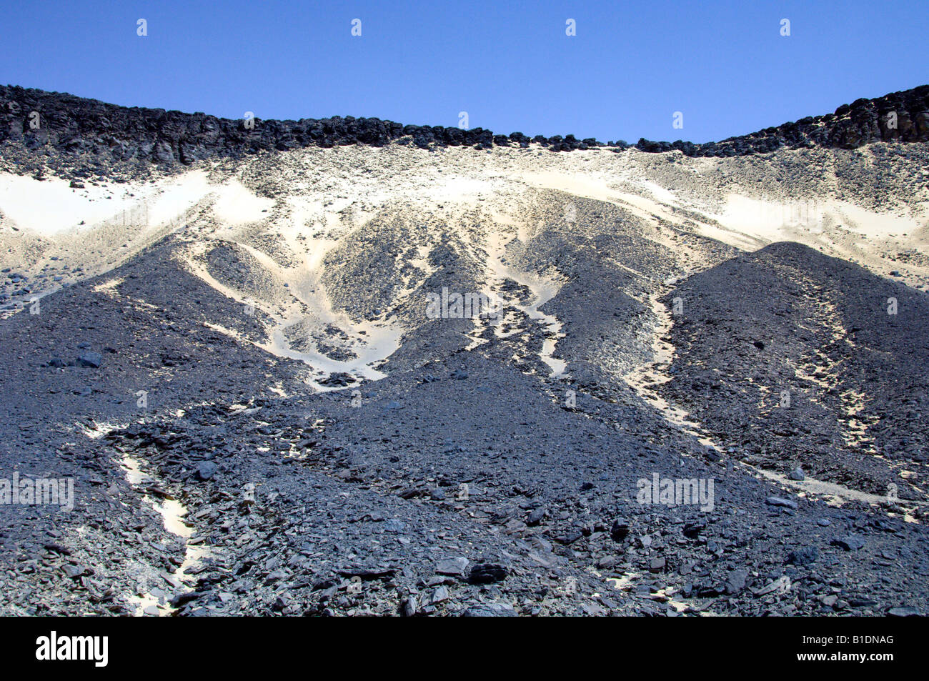 A mountain of volcanic origin in the Black Desert of western Egypt ...