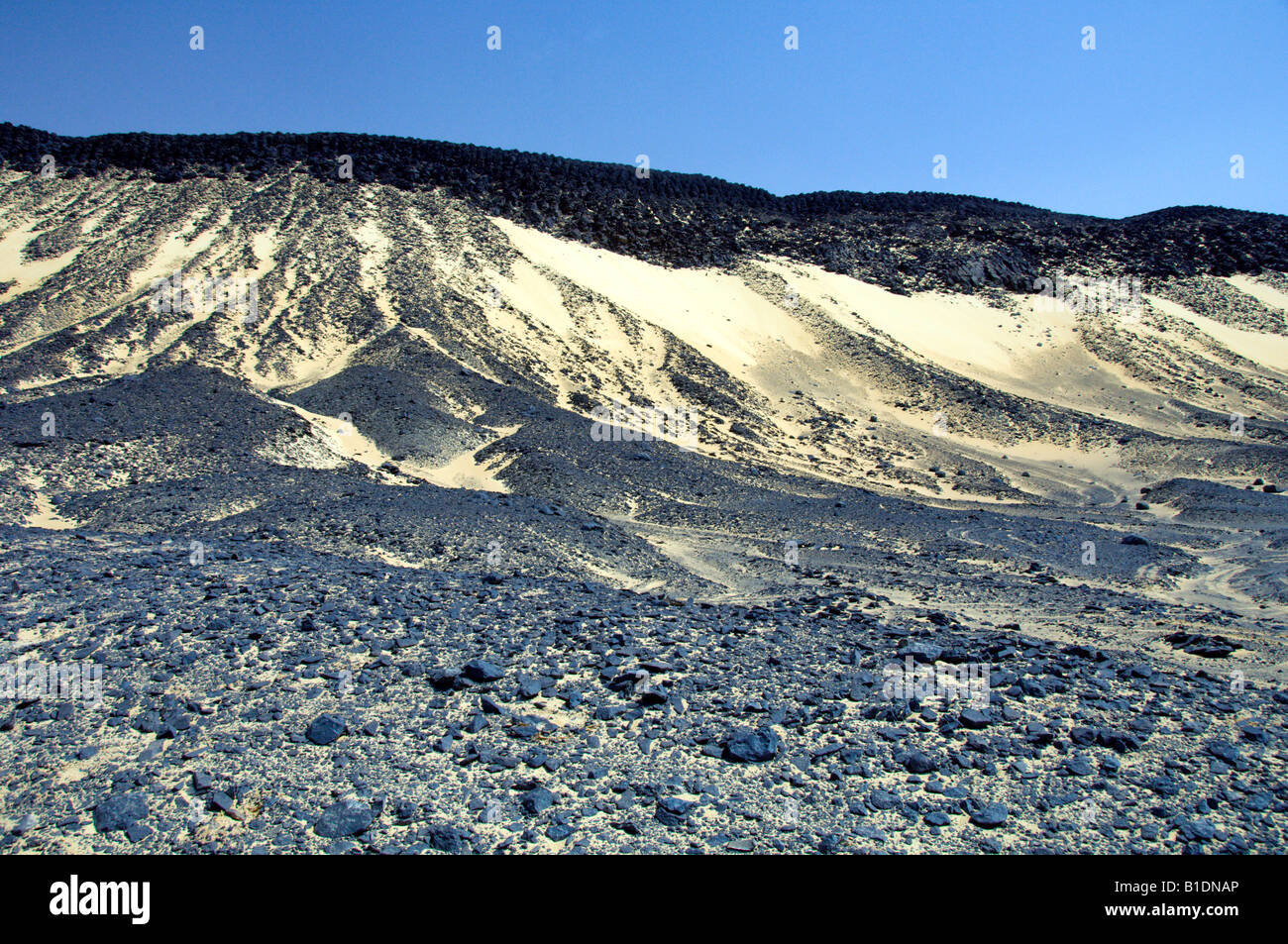 A mountain of volcanic origin in the Black Desert of western Egypt ...