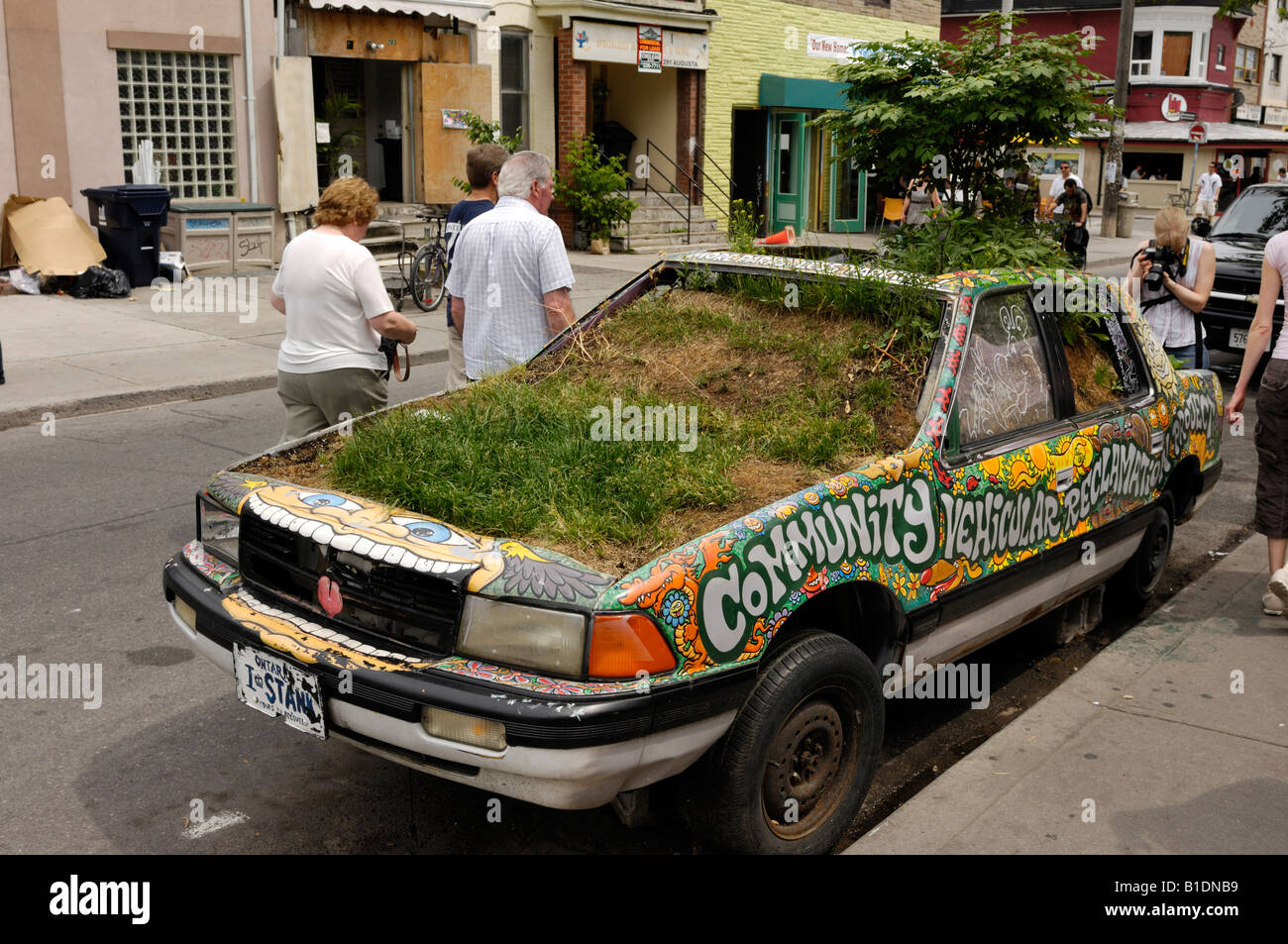 Old car turned into a flowerbed Stock Photo - Alamy