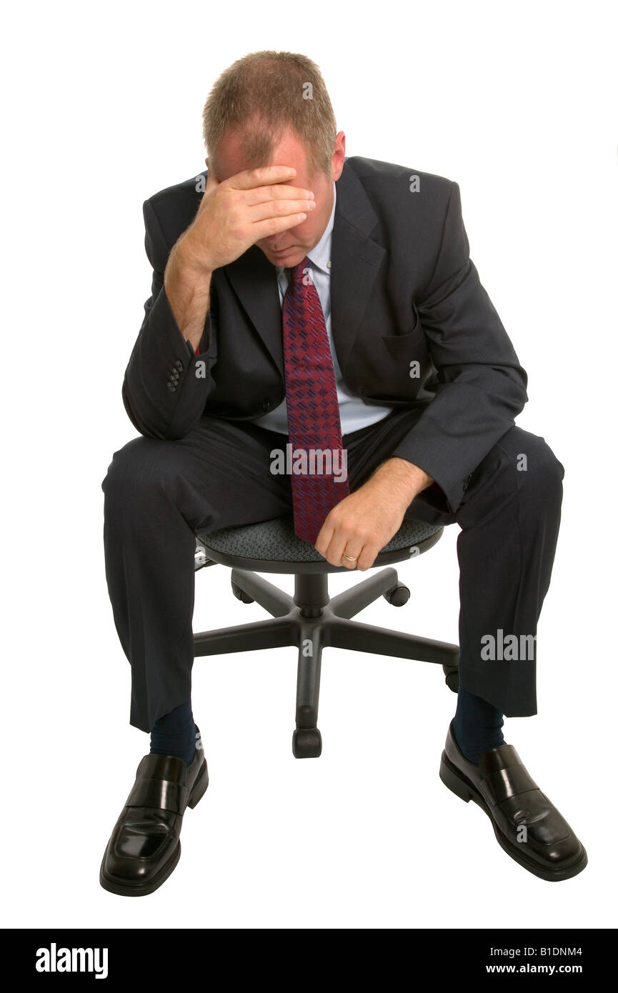 Man sitting on chair head in hands Cut Out Stock Images & Pictures - Alamy