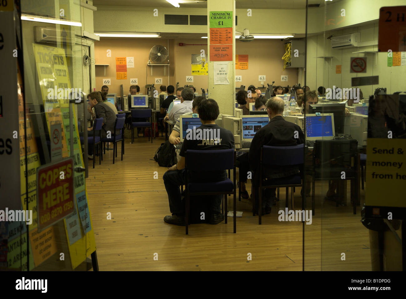 People inside internet cafe Stock Photo - Alamy