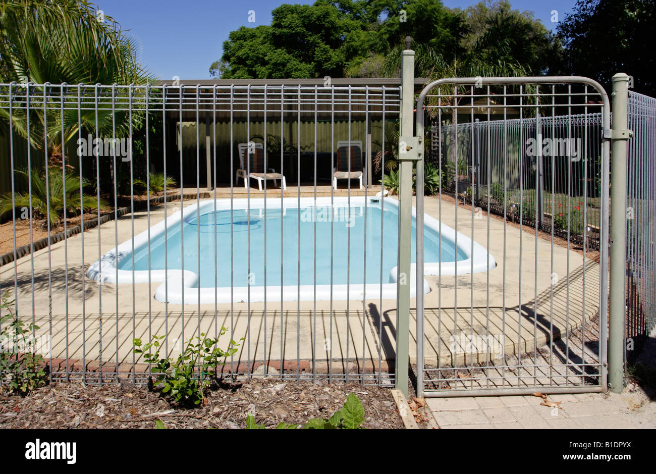 Safety fence around a swimming pool. This is a legal requirement in ...