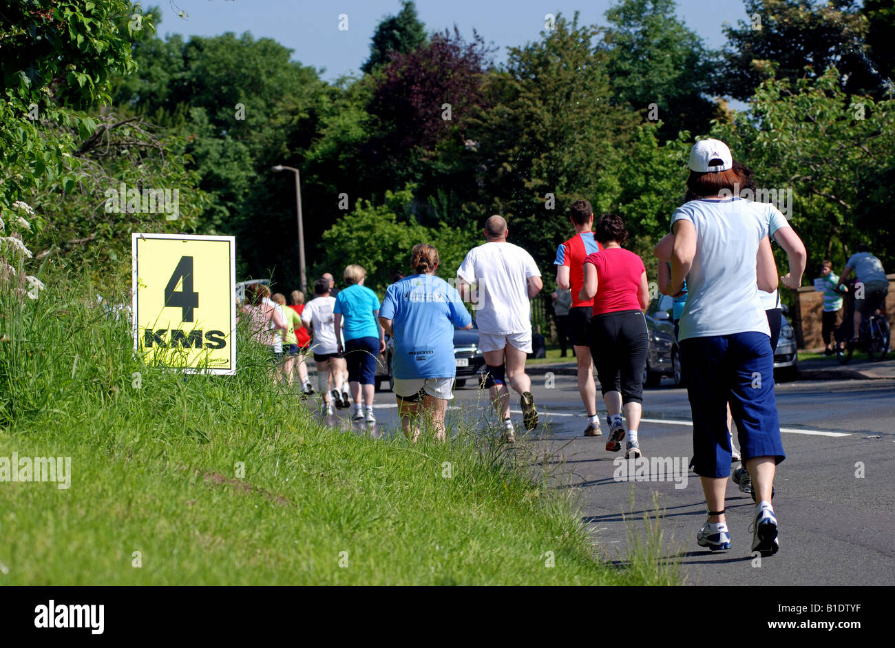 Runners at 4K distance in 10K road race, UK Stock Photo - Alamy