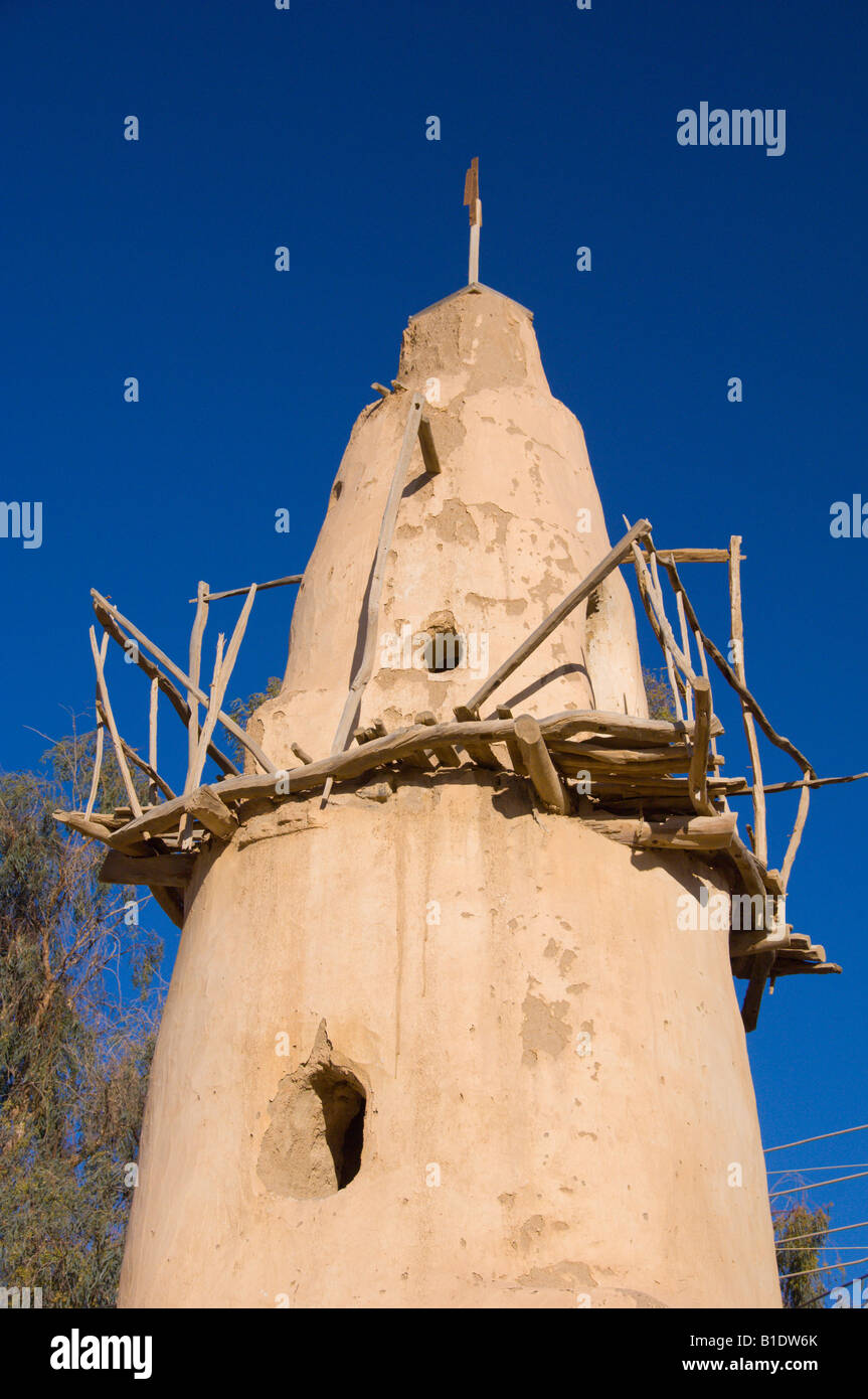 The mud minaret of the original old mosque in the village of Bawiti ...
