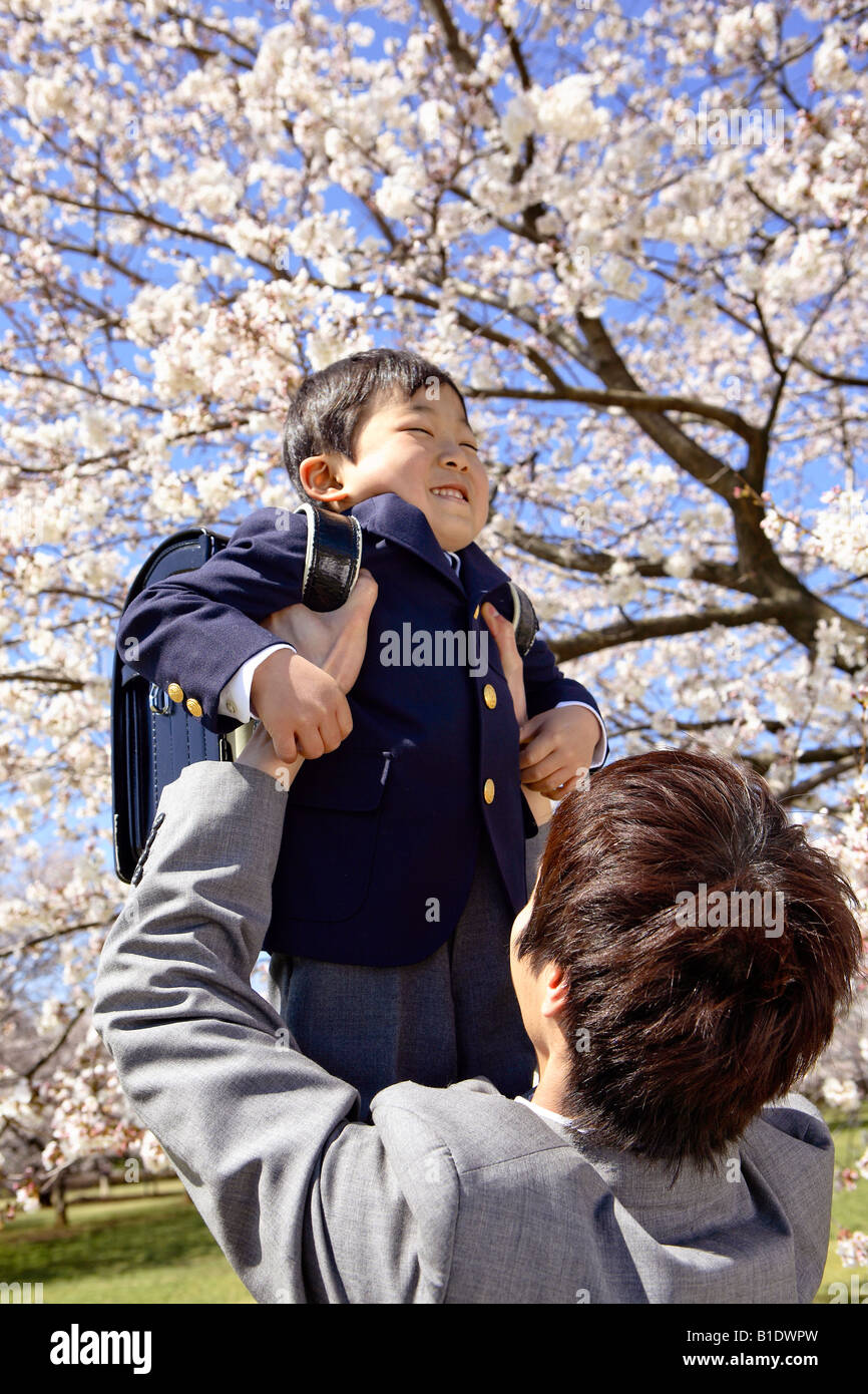Father lifting up his son Stock Photo - Alamy