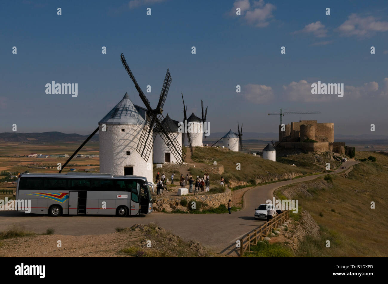 Windmill and castle, Consuegra, Spain Stock Photo - Alamy