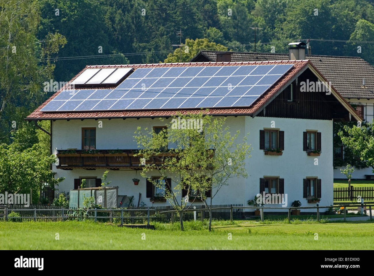Solar panels fitted to the roof of a house near Waging, Bavaria ...
