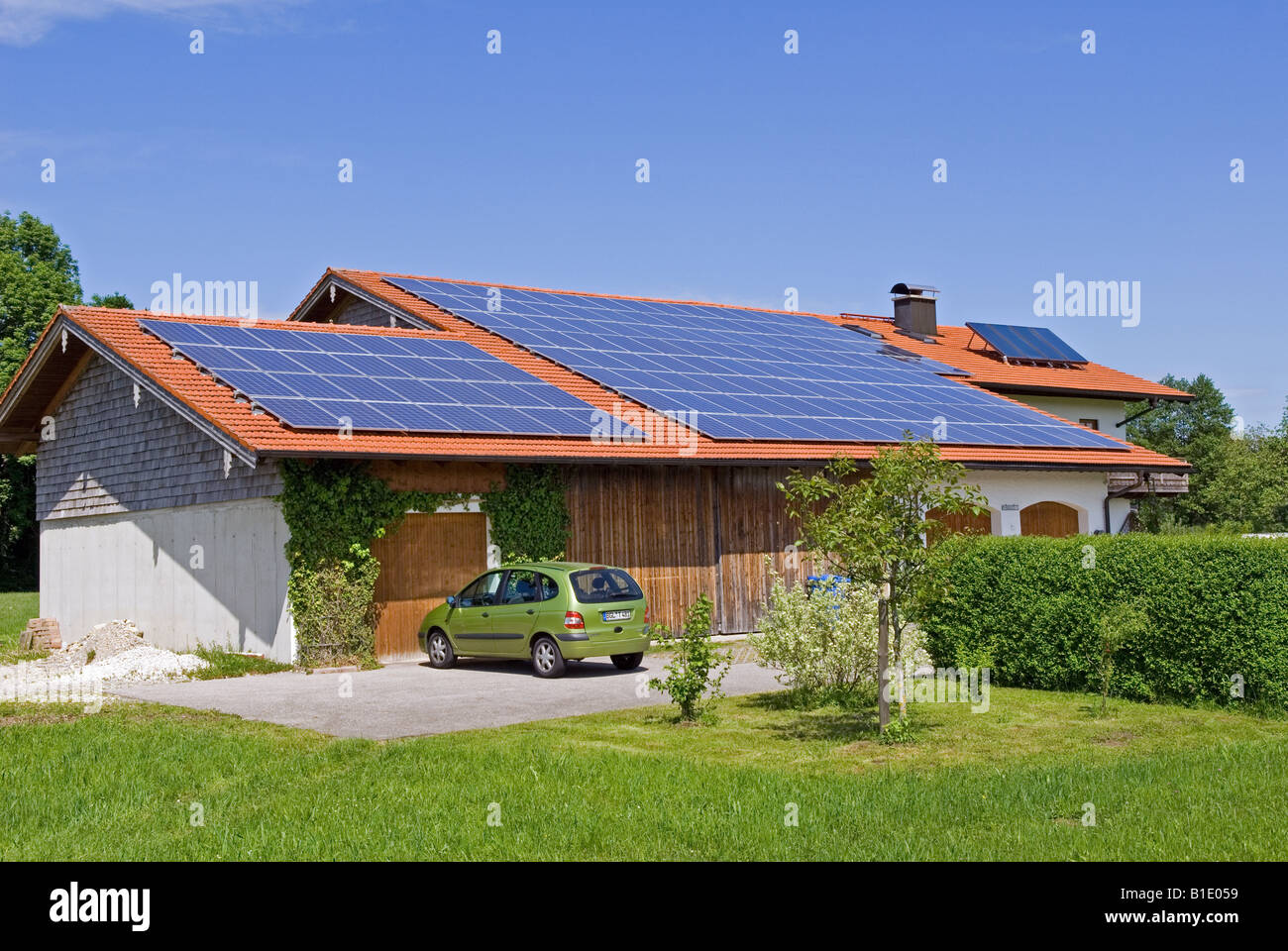 Solar panels fitted to the roof of a house near Waging, Bavaria ...