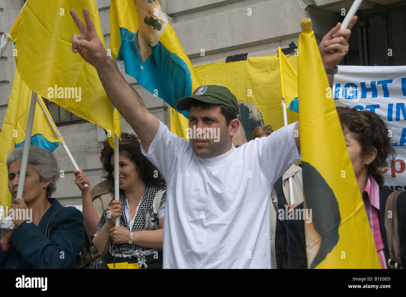 Kurdish demonstrators with flags showing the Kurish leader Abdullah ...