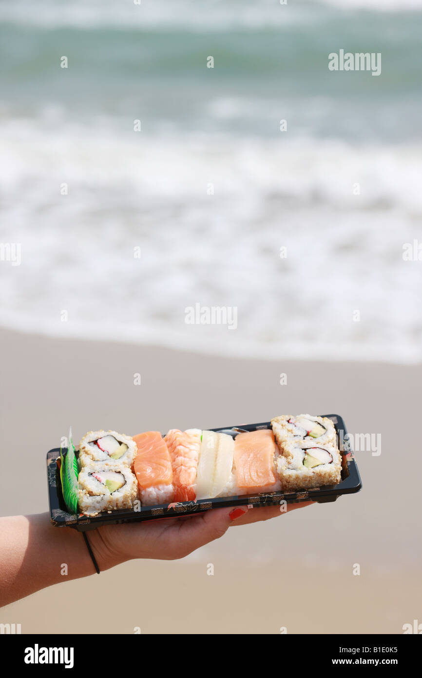 Young Woman Holding Sushi Model Released Stock Photo - Alamy