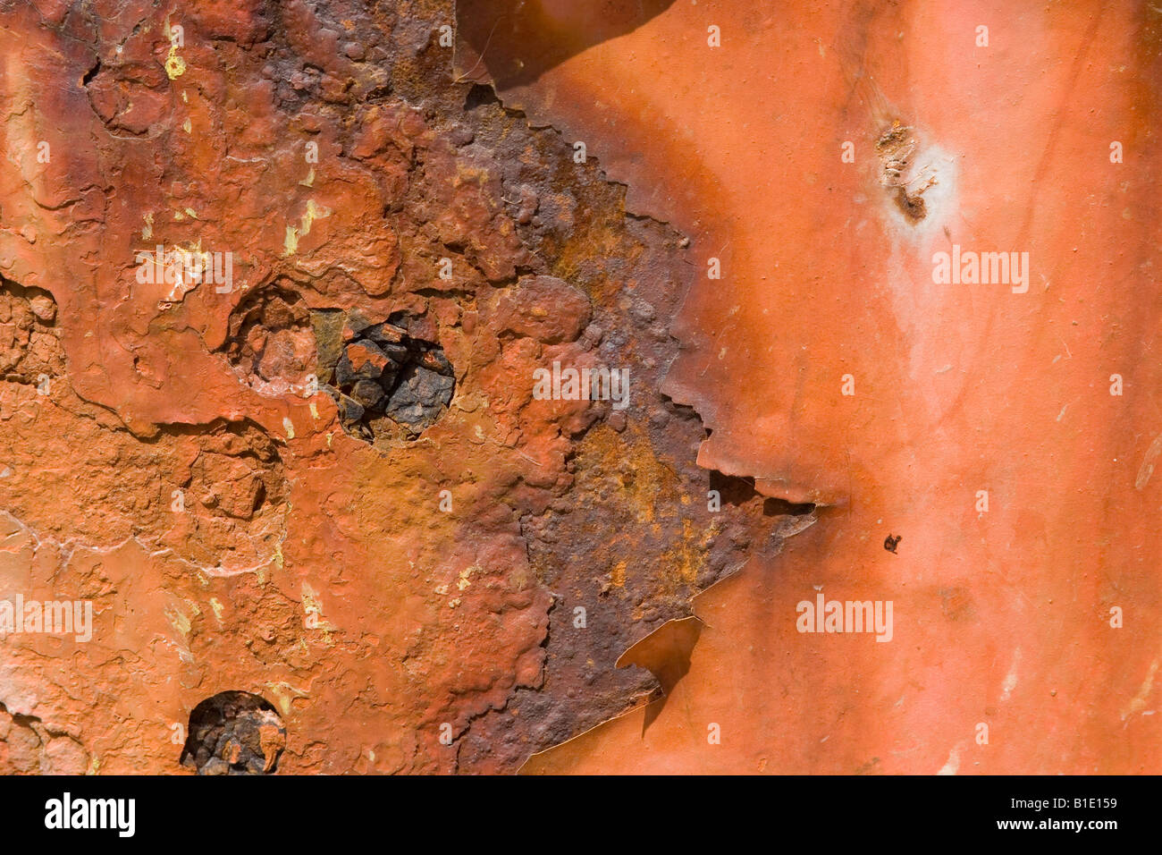 Bright orange peeling rust background texture Stock Photo - Alamy