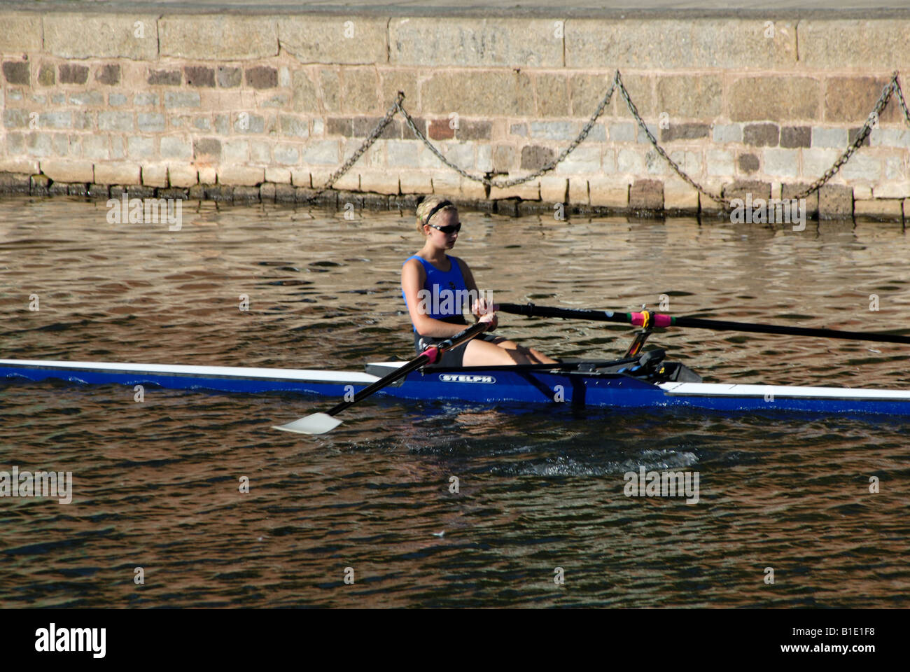 Girl rowing canoe on the river Stock Photo - Alamy