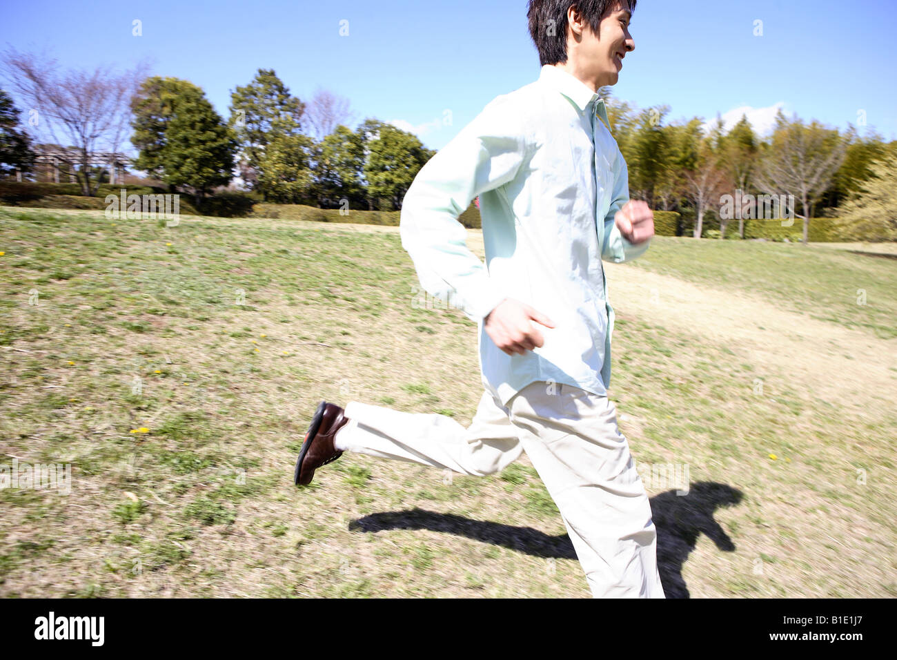 Japanese man jogging in the park Stock Photo - Alamy