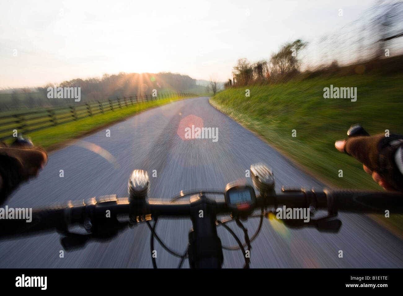 Wide angle view taken from perspective of bicycle rider on rural ...