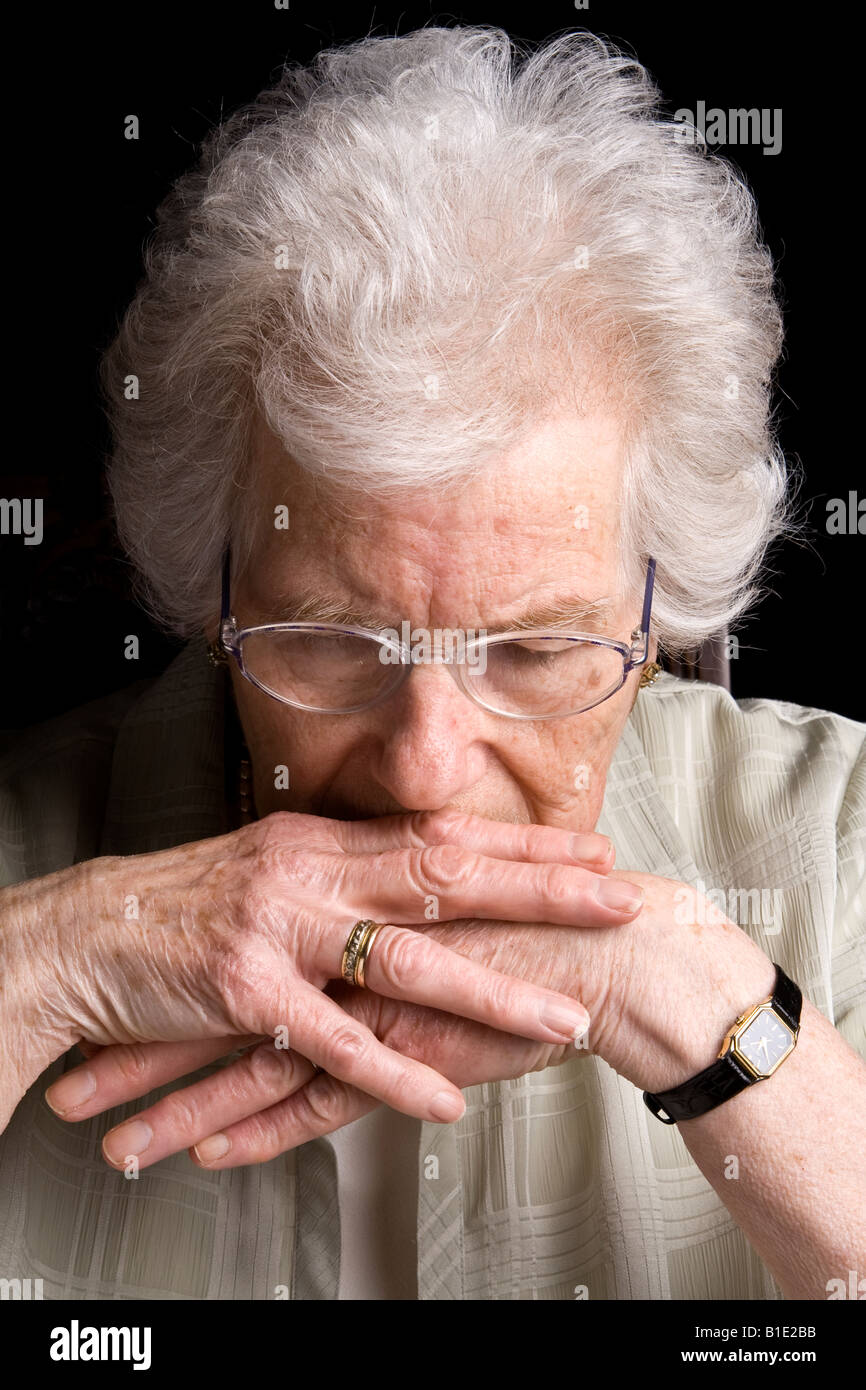 An old woman looking worried, UK Stock Photo - Alamy
