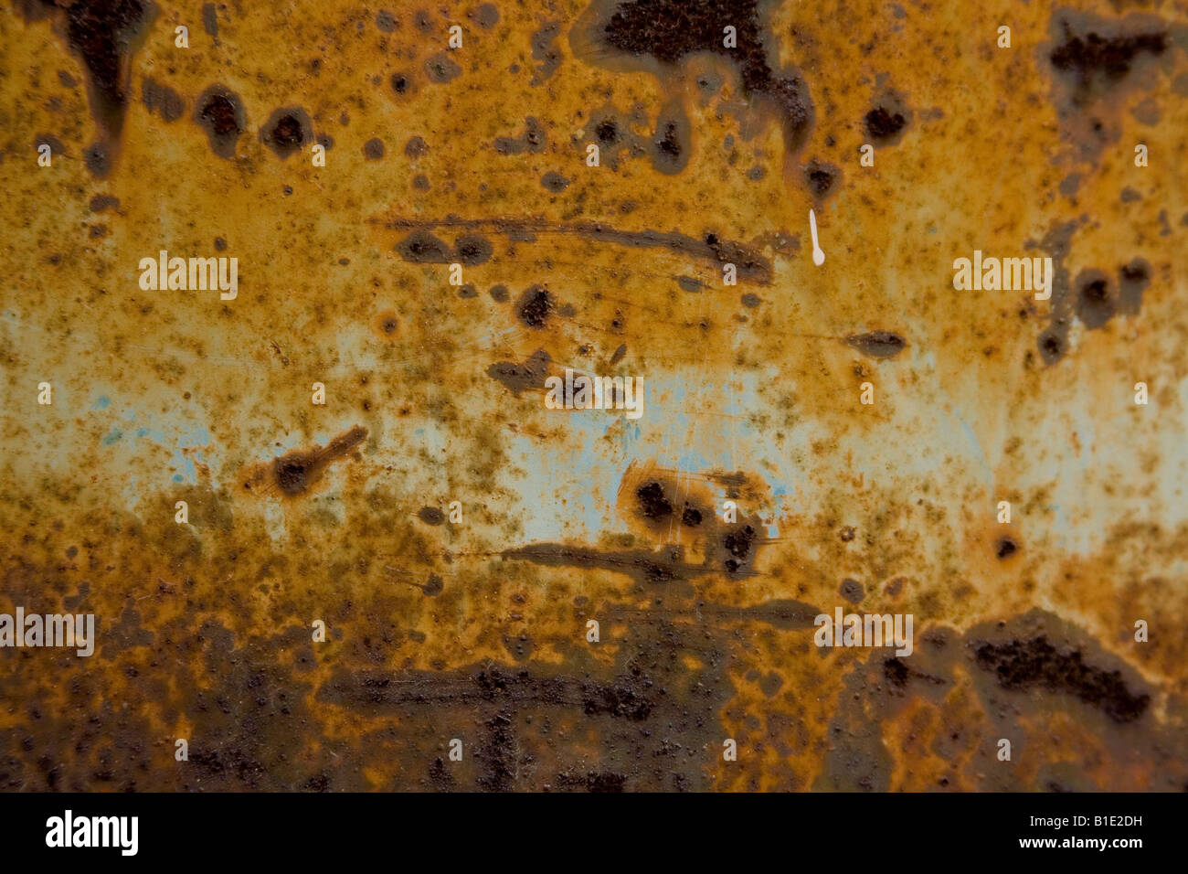 Scratch marks on golden orange metallic background with dark rust from ...