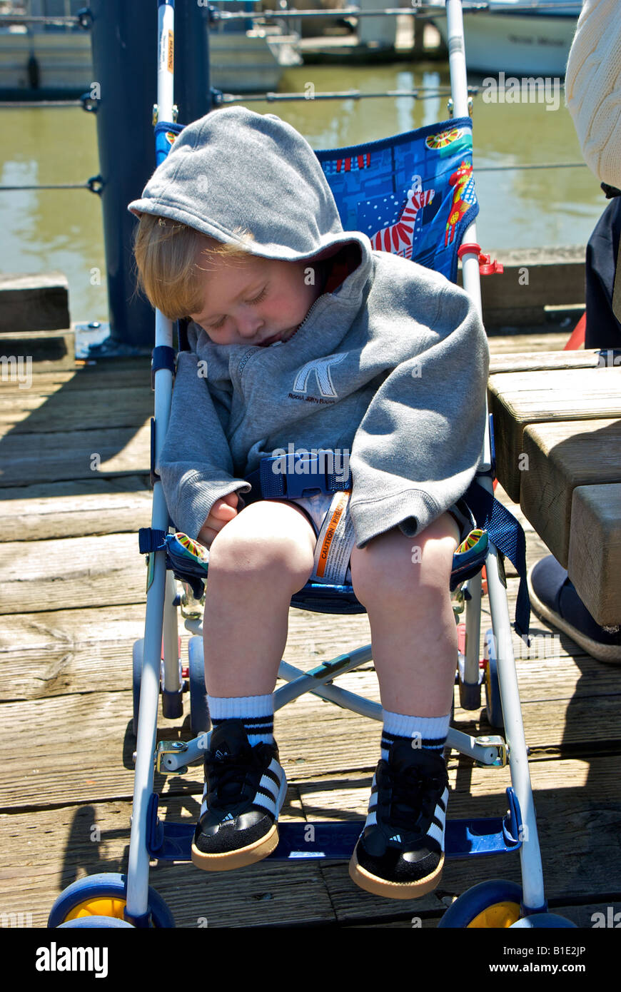 Baby sleeping on stroller in hi-res stock photography and images - Alamy