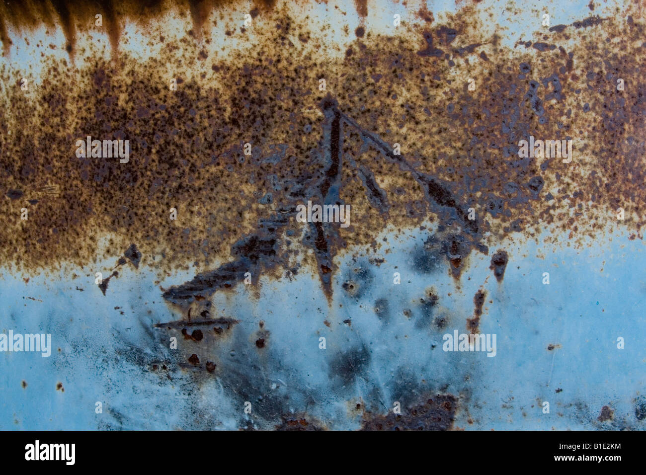 Scratch marks through blue paint and rust on metallic background Stock ...