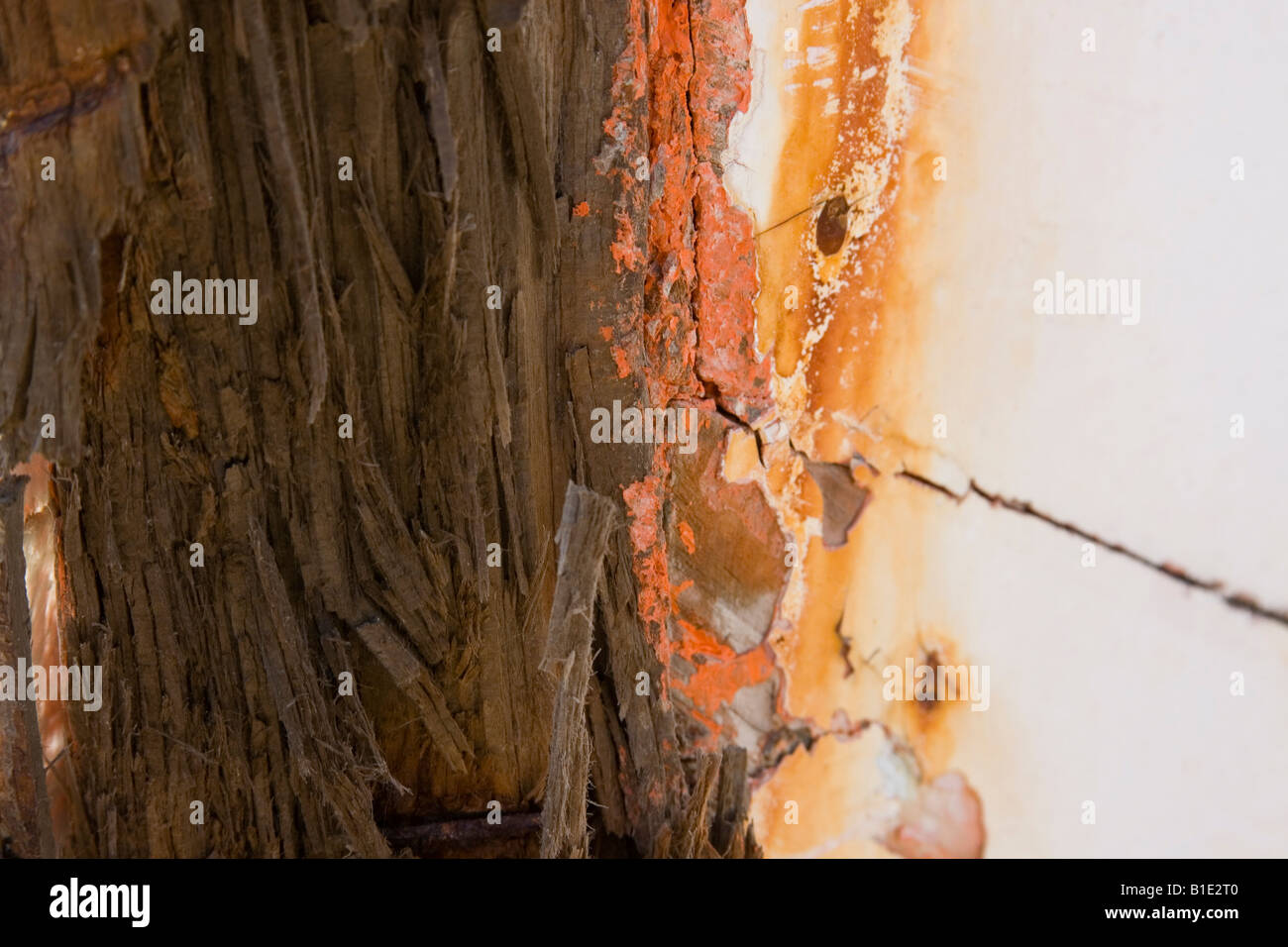 Background of broken wall with old rotten wood showing through Stock ...
